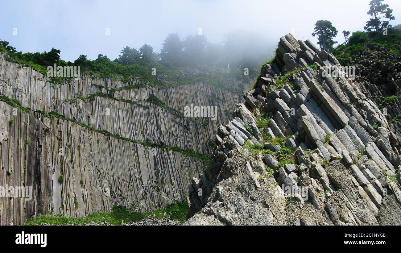 Column basalts formation of Stolbchaty cape at Kunashir, kuril islands ...