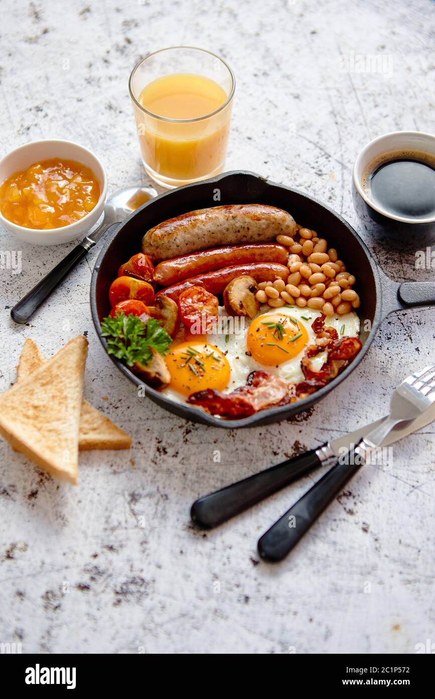 Full English breakfast on bright rusty background Stock Photo - Alamy