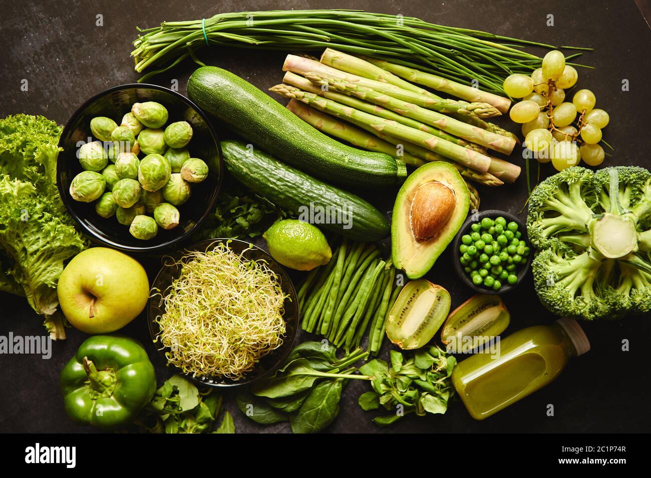 Green healthy food composition with avocado, broccoli, apple, smoothie ...