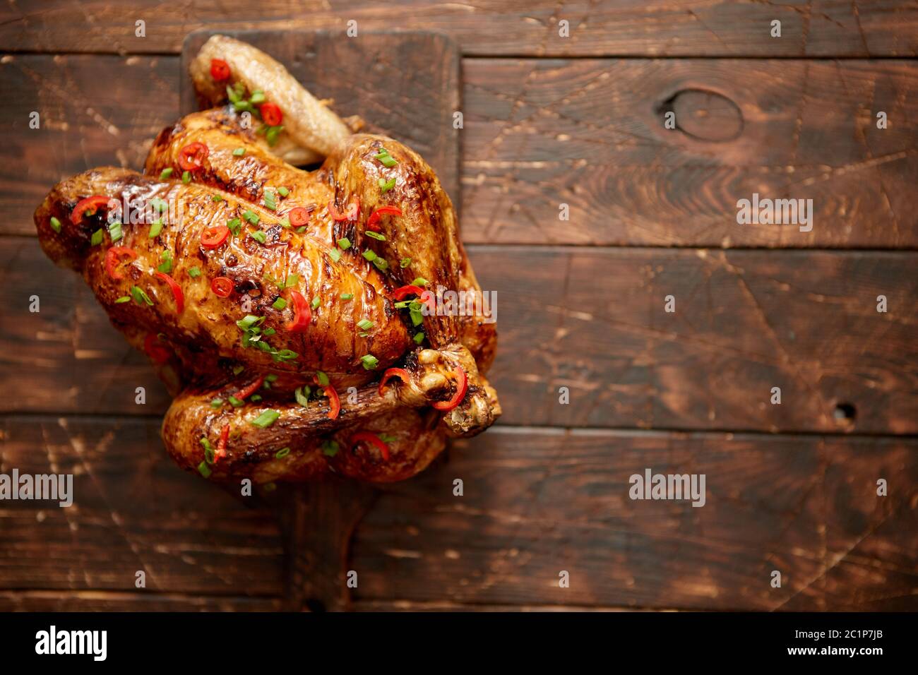 Homemade roasted spicy chicken with chilli and chive Stock Photo - Alamy