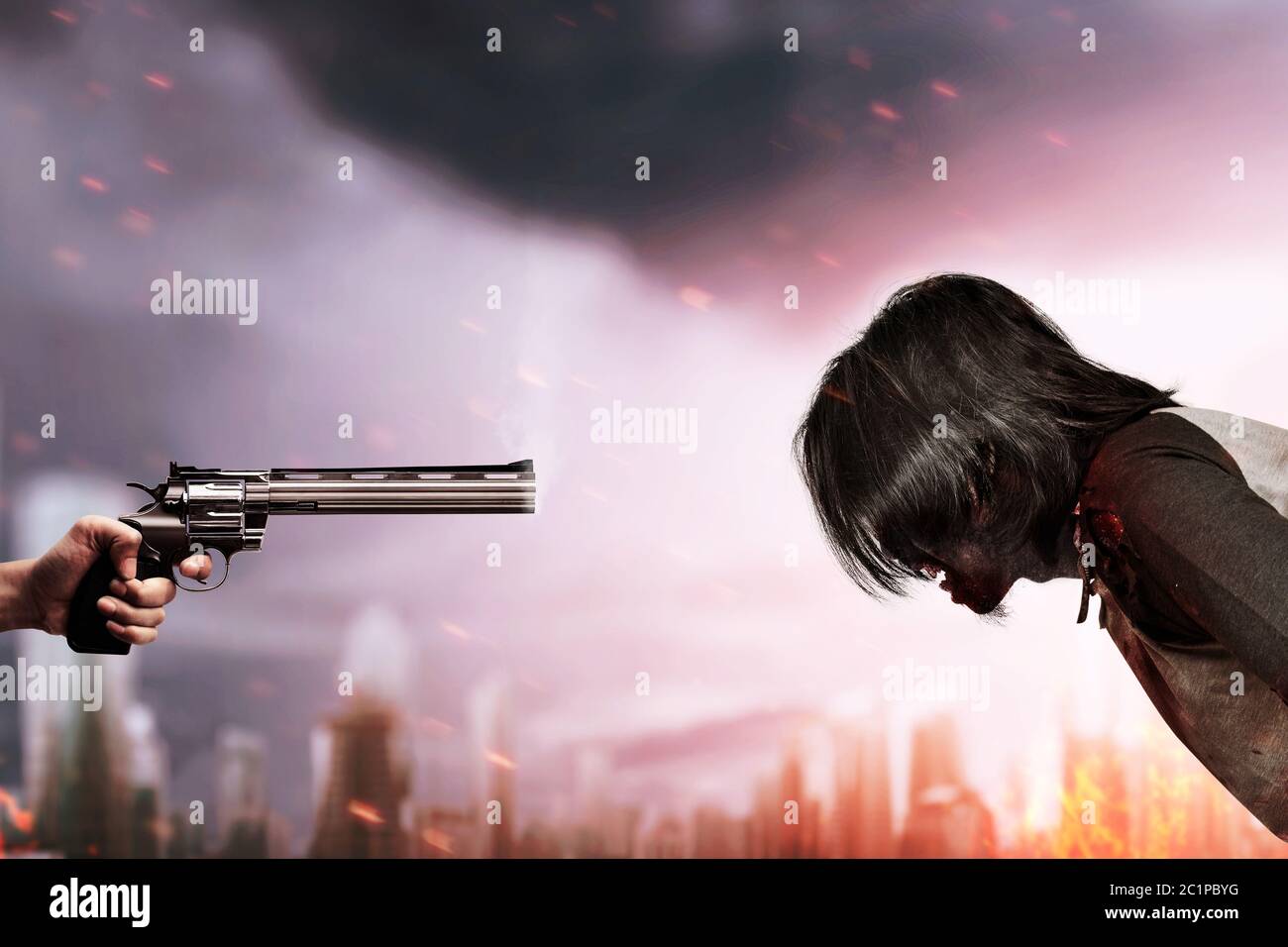 Hand pointing a gun to zombies on the city. Halloween concept Stock ...
