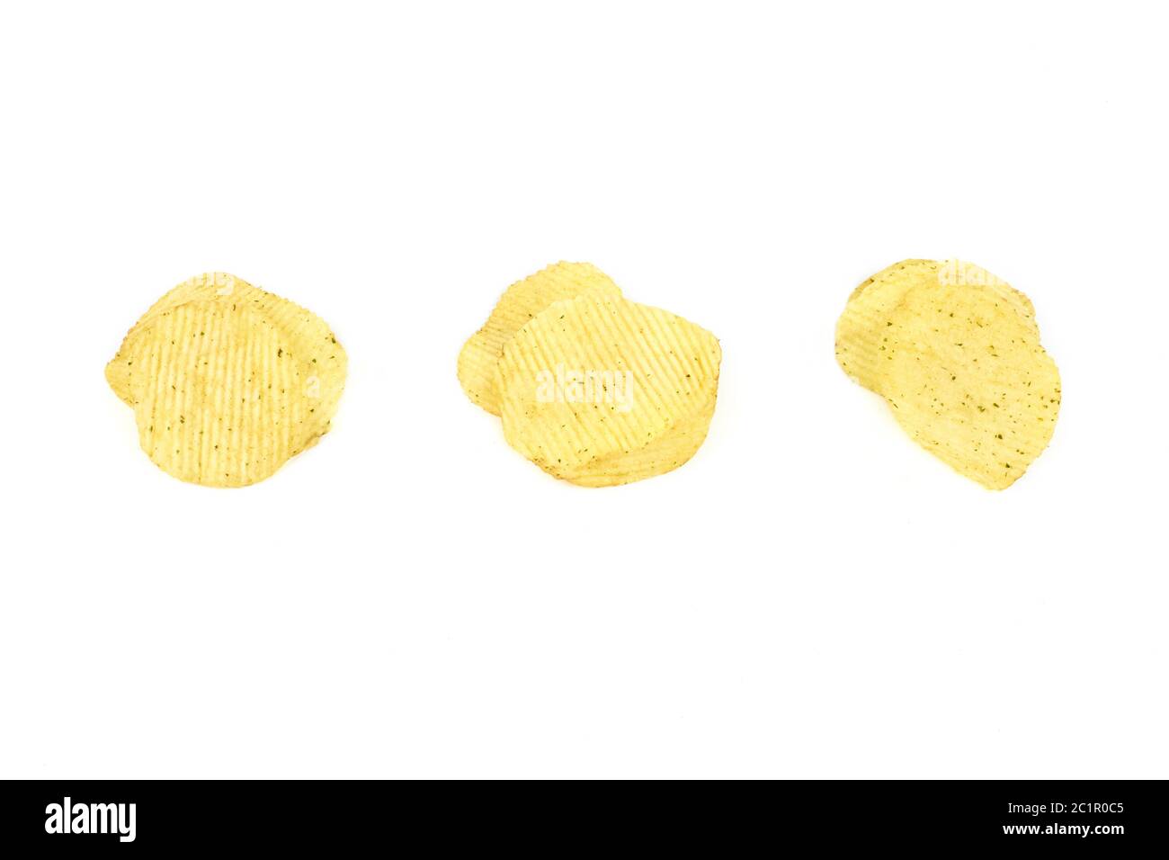 yellow potato chips isolated on white background Stock Photo - Alamy