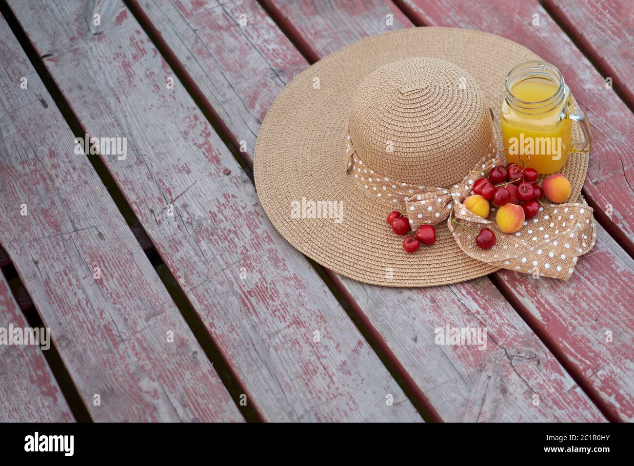 Glass of tropical exotic multifruit juice and fruits at the pier ...