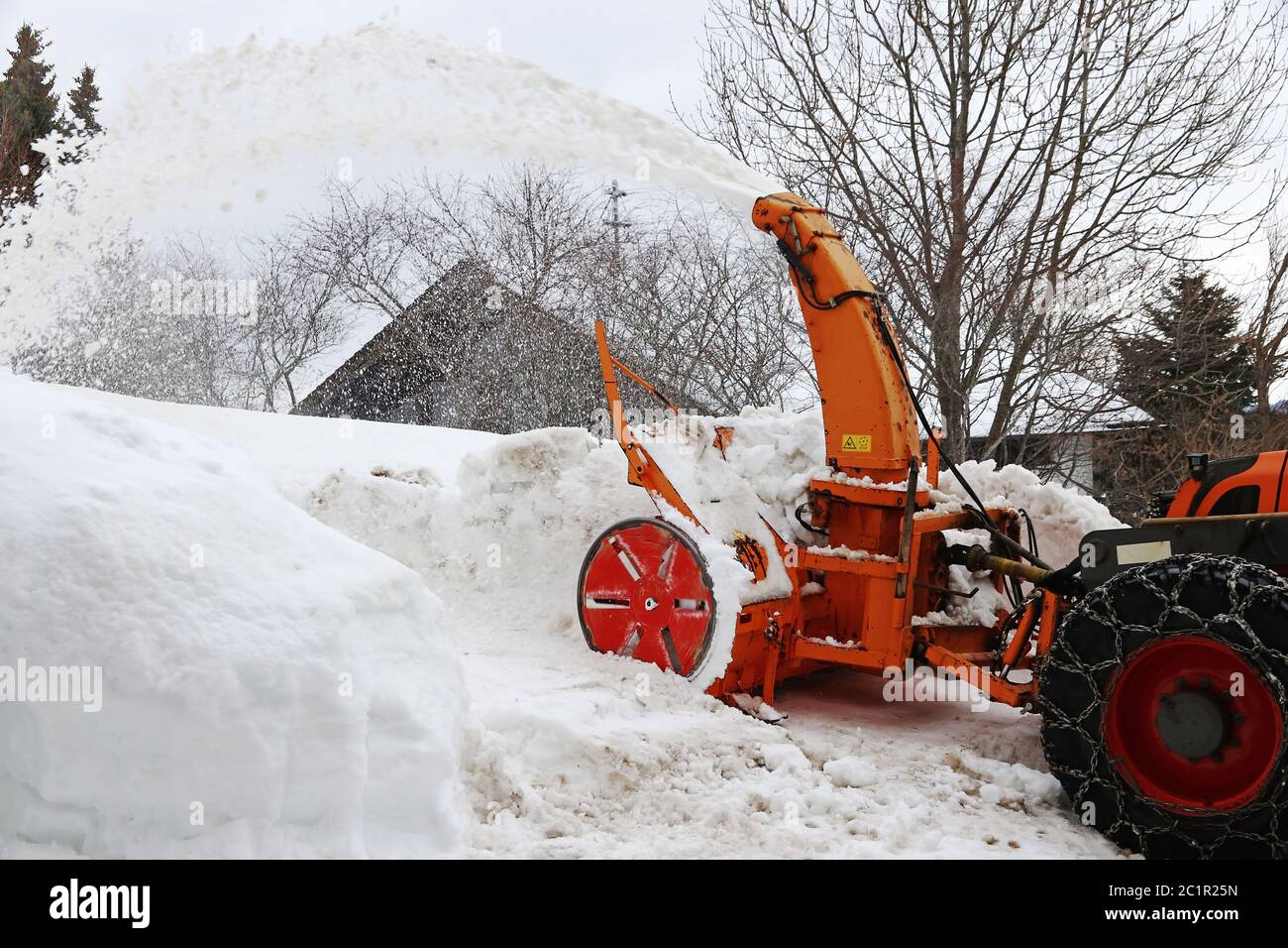 Snow clearing work with a large snow blower in winter Stock Photo - Alamy
