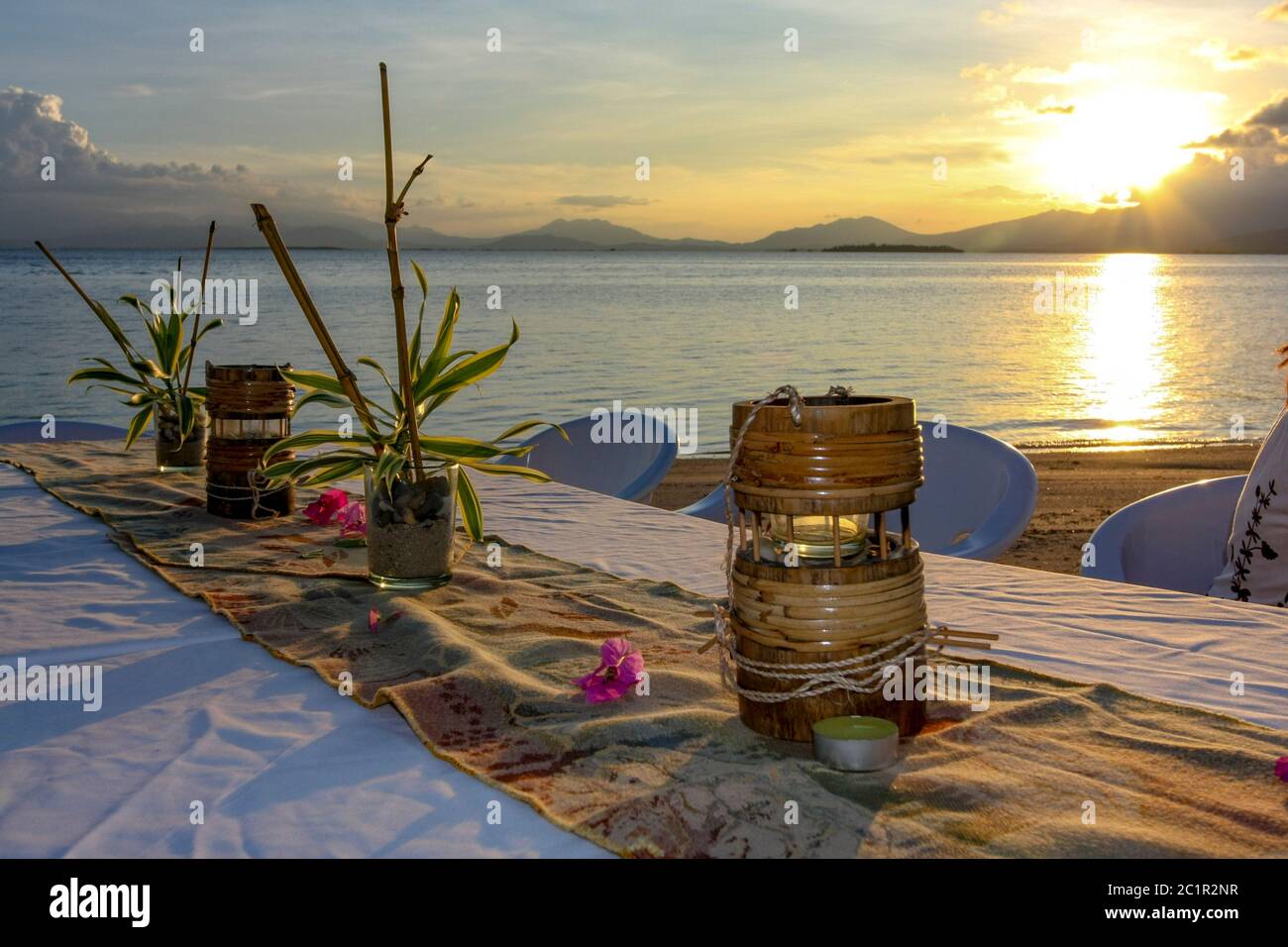Sunset dinner on a paradise beach Stock Photo - Alamy