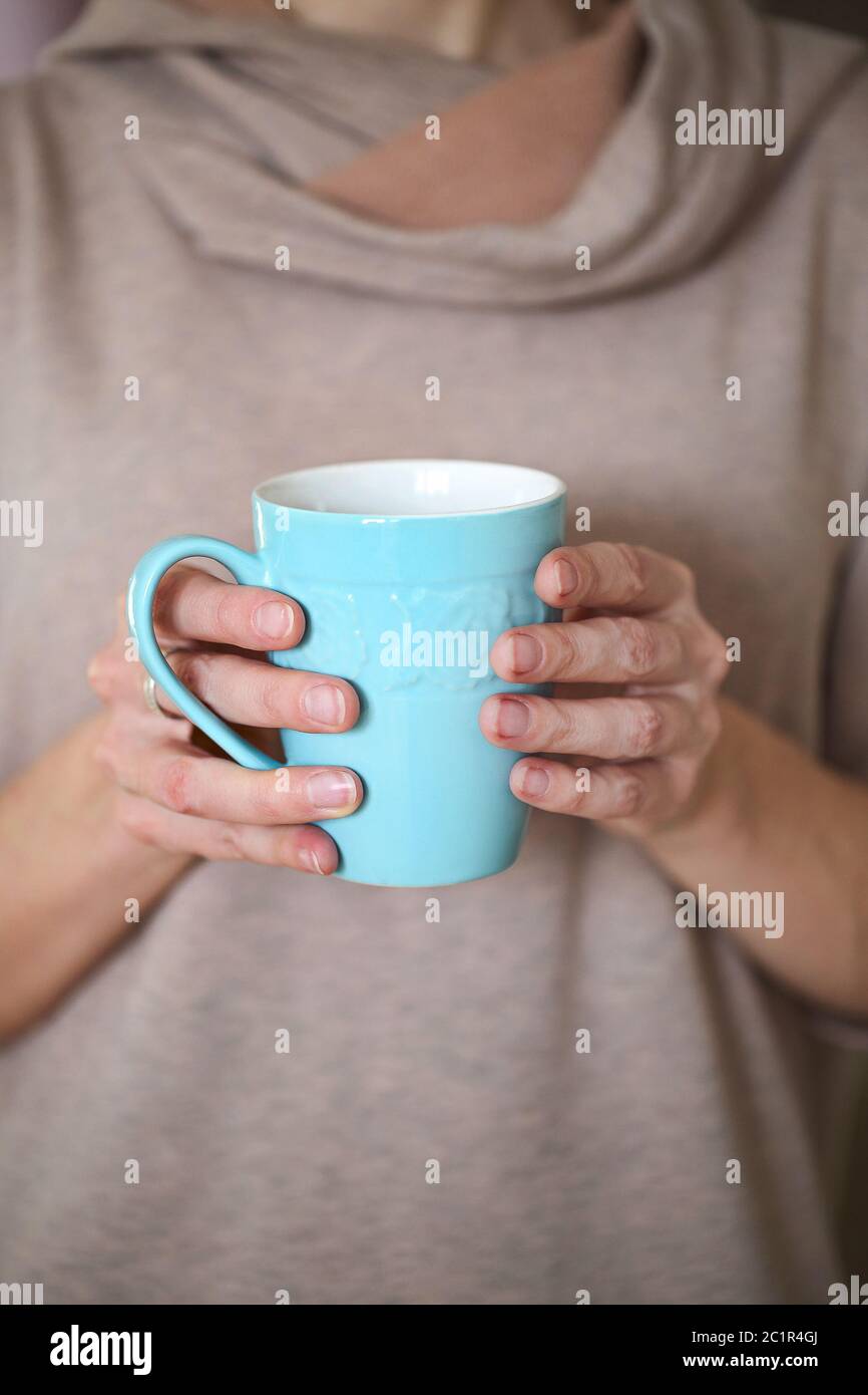 Female hands holding cup of freshly made cacao drink Stock Photo - Alamy