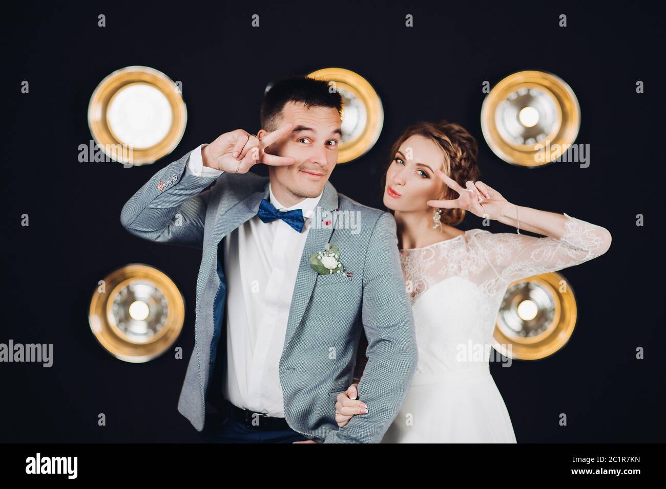 Positive wedding couple having fun and dancing at party Stock Photo - Alamy