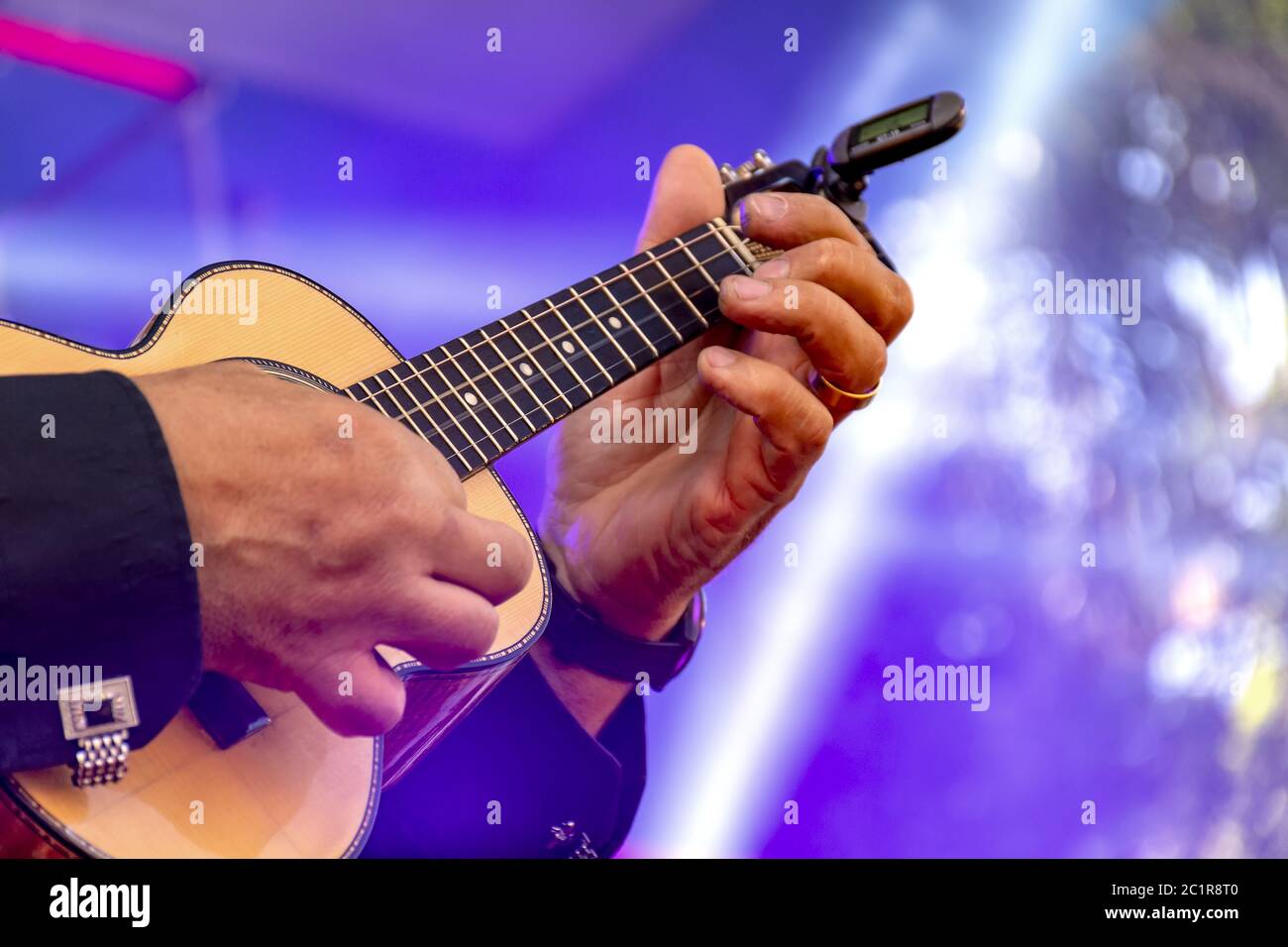 Four strings acoustic guitar performer Stock Photo - Alamy