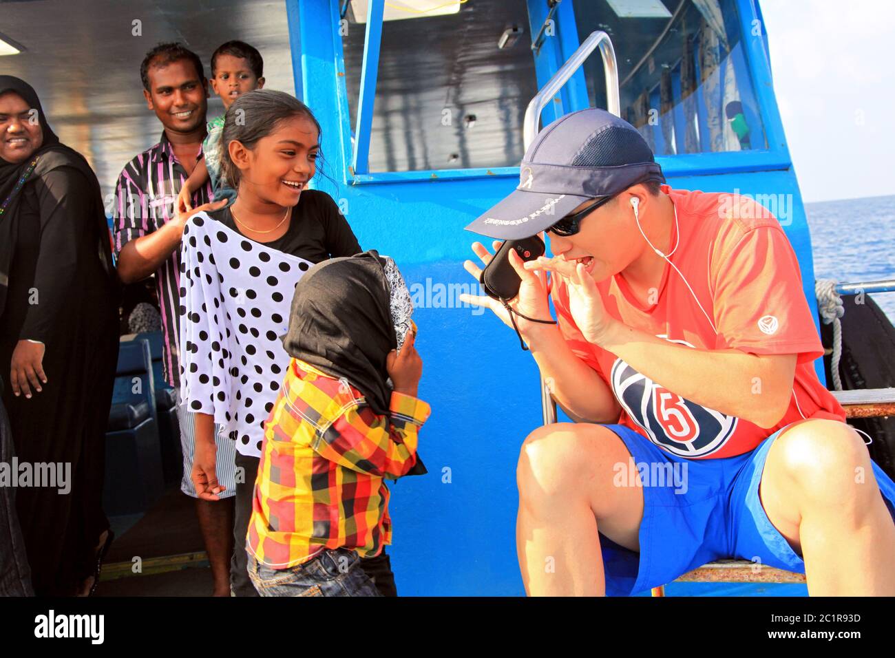Male, Maldives - November 24, 2012: group of beautiful people enjoy a ...