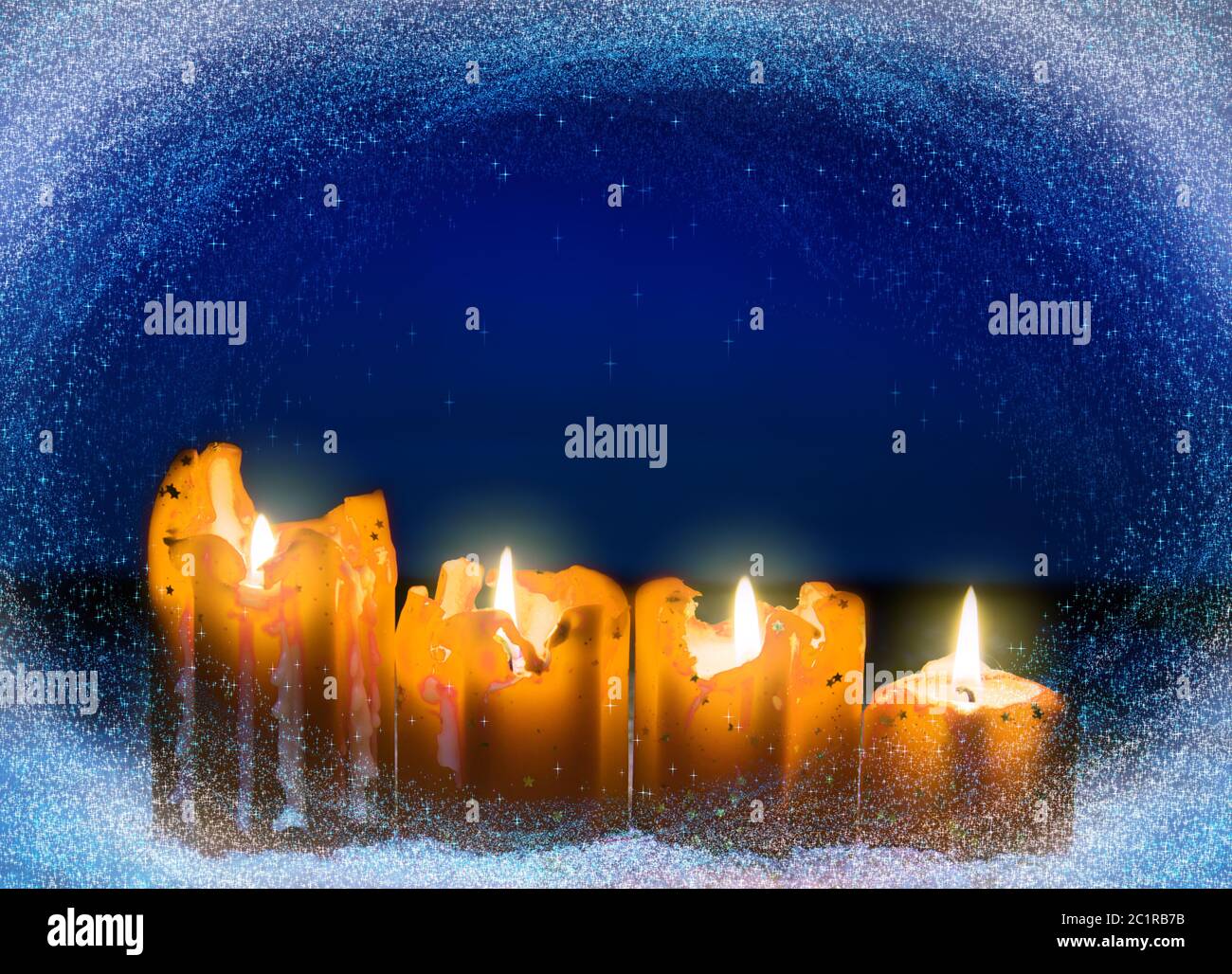 Four yellow Christmas candle for Advent and snow frame Stock Photo - Alamy