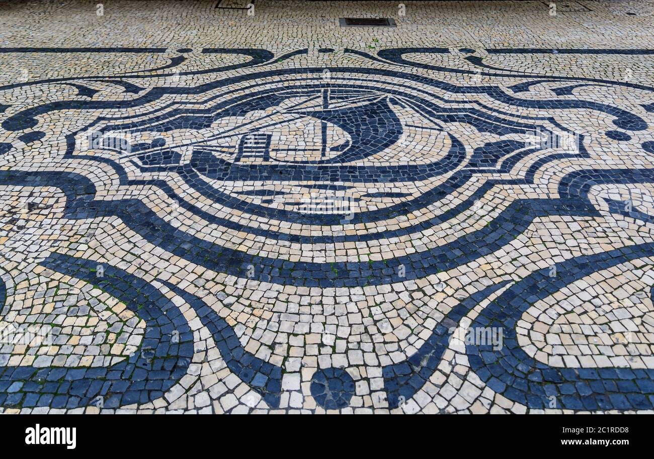 Antique ornate mosaic cobblestone design with a ship motif on a ...