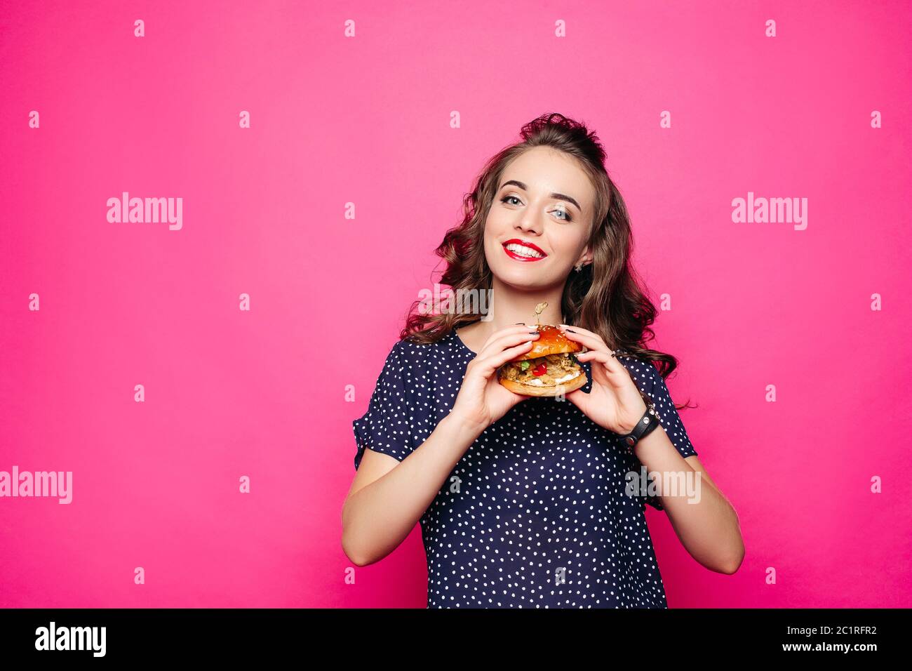 Student girl eating hamburger hi-res stock photography and images - Alamy