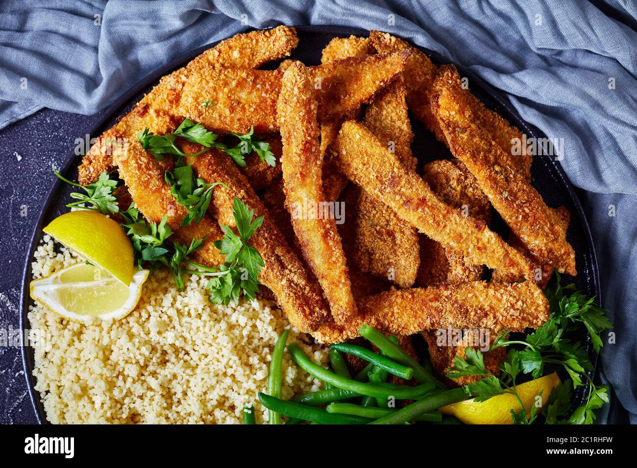 close-up of green beans with fish sticks, fish fillet fingers breaded ...