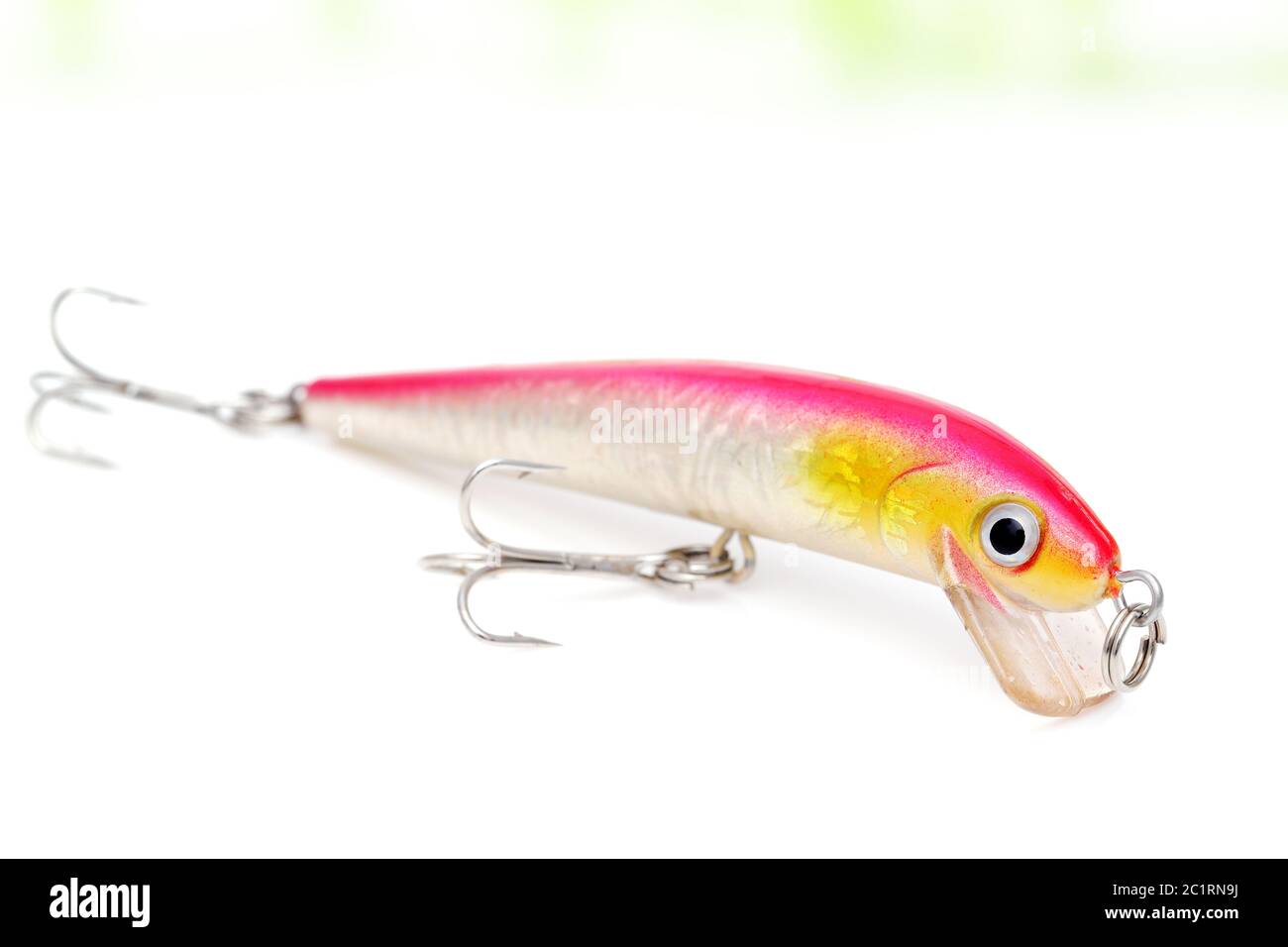 Plastic fishing lure on a white background Stock Photo - Alamy