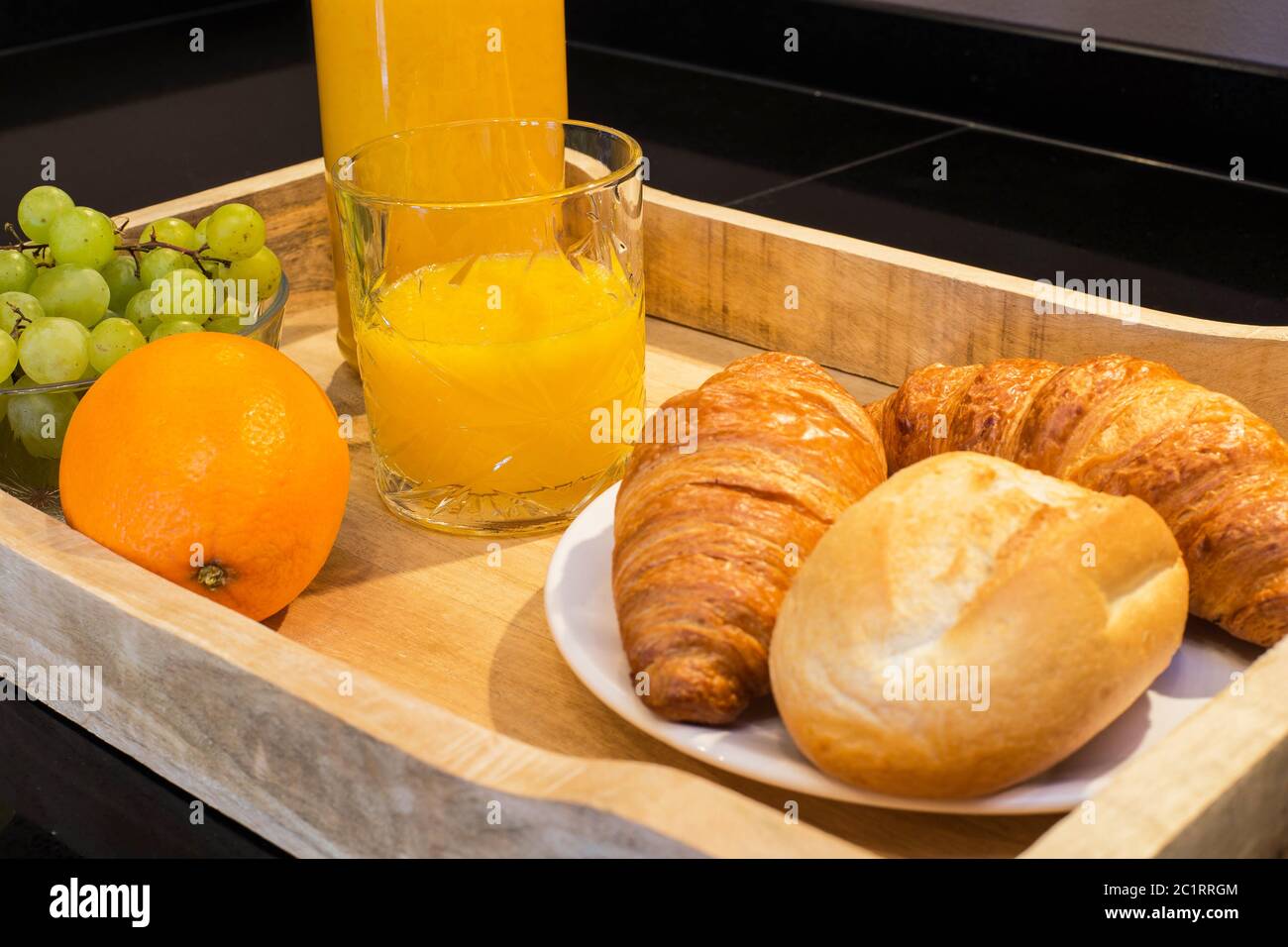 breakfast tray with orange juice croissants and fruit Stock Photo - Alamy