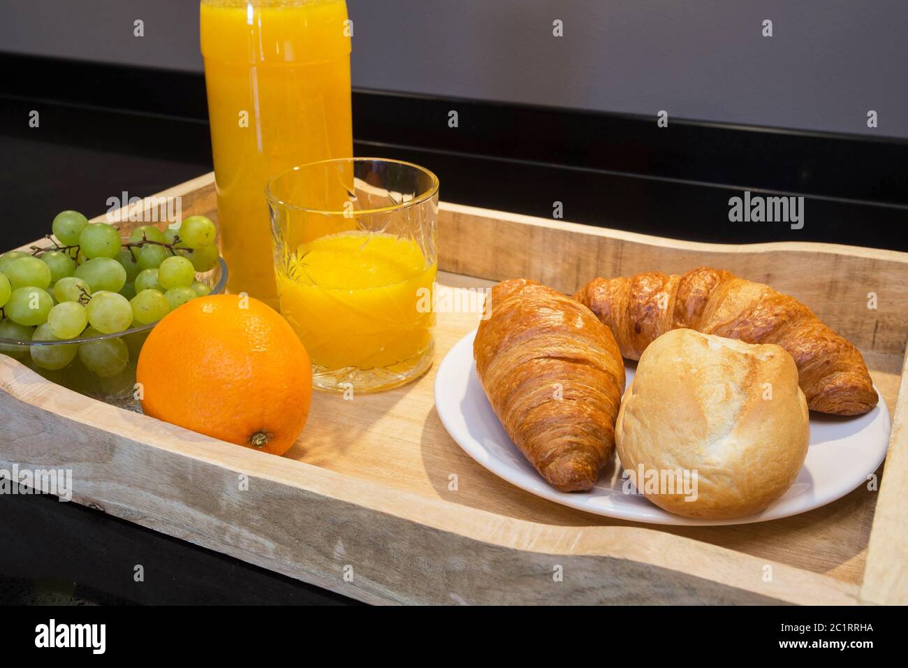 breakfast tray with orange juice croissants and fruit Stock Photo - Alamy