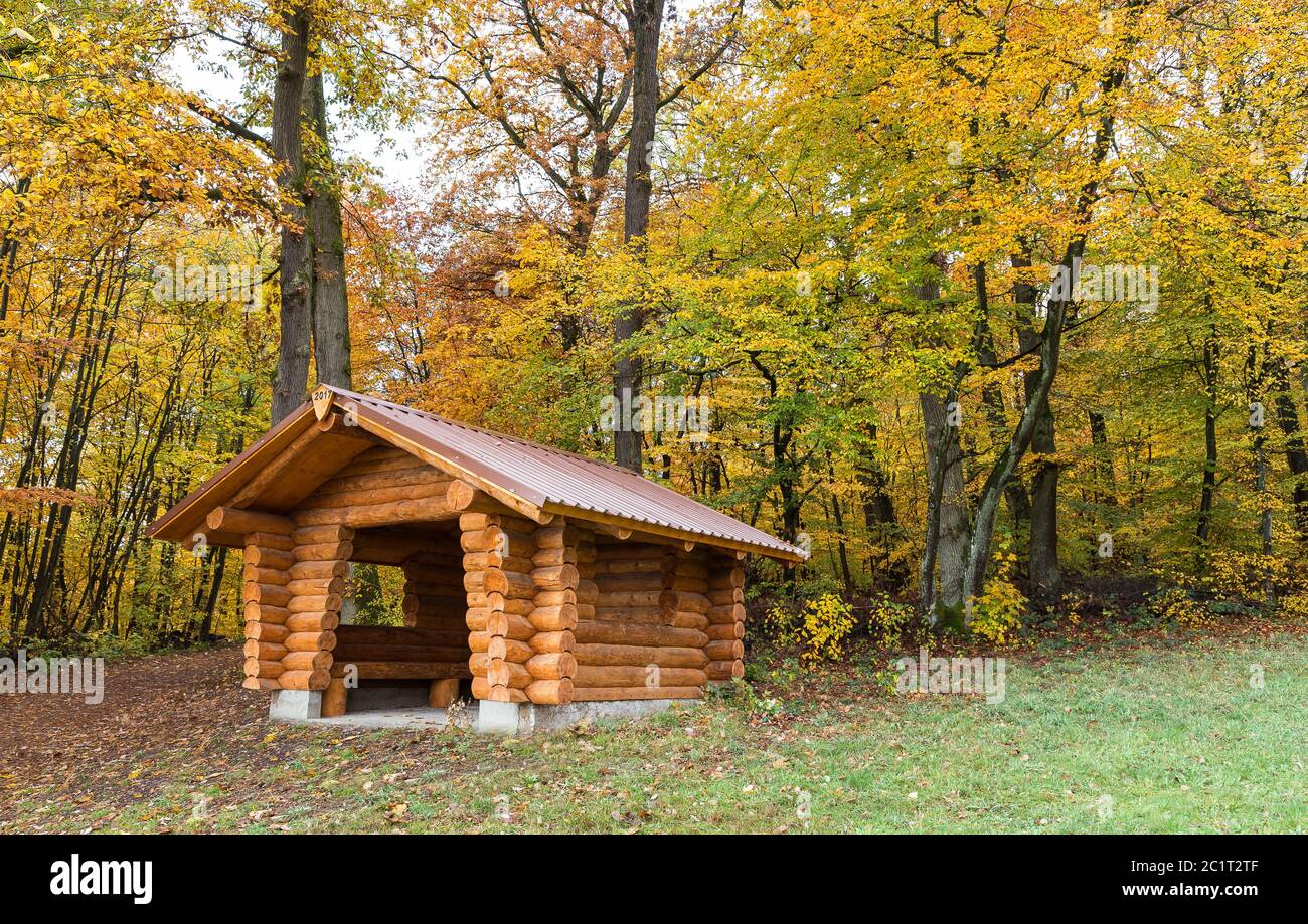 Wooden hut made of tree trunks at the edge of the forest Stock Photo ...