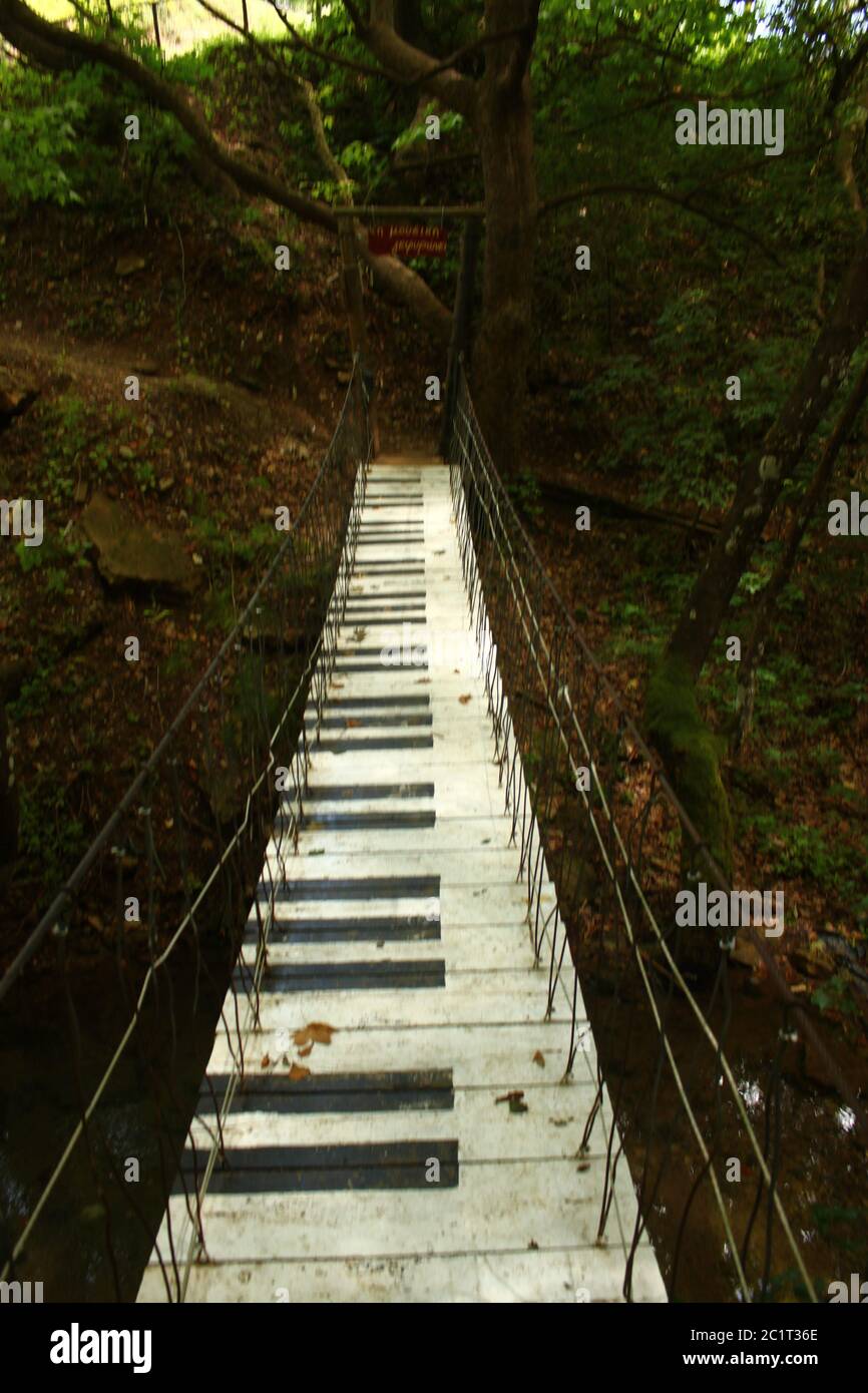 A wooden bridge painted like a piano keyboard Stock Photo - Alamy