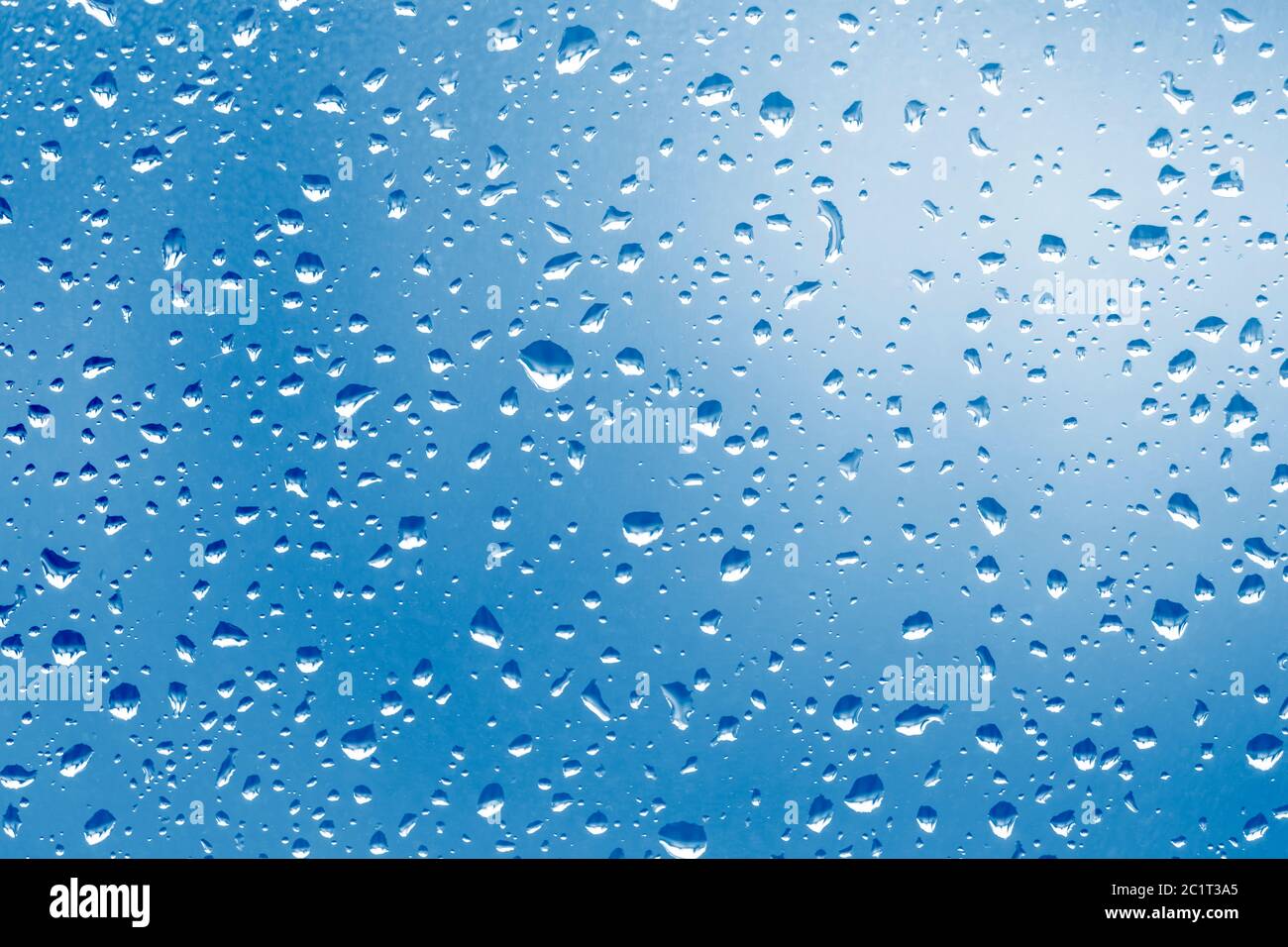 Water drops on blue background Stock Photo - Alamy
