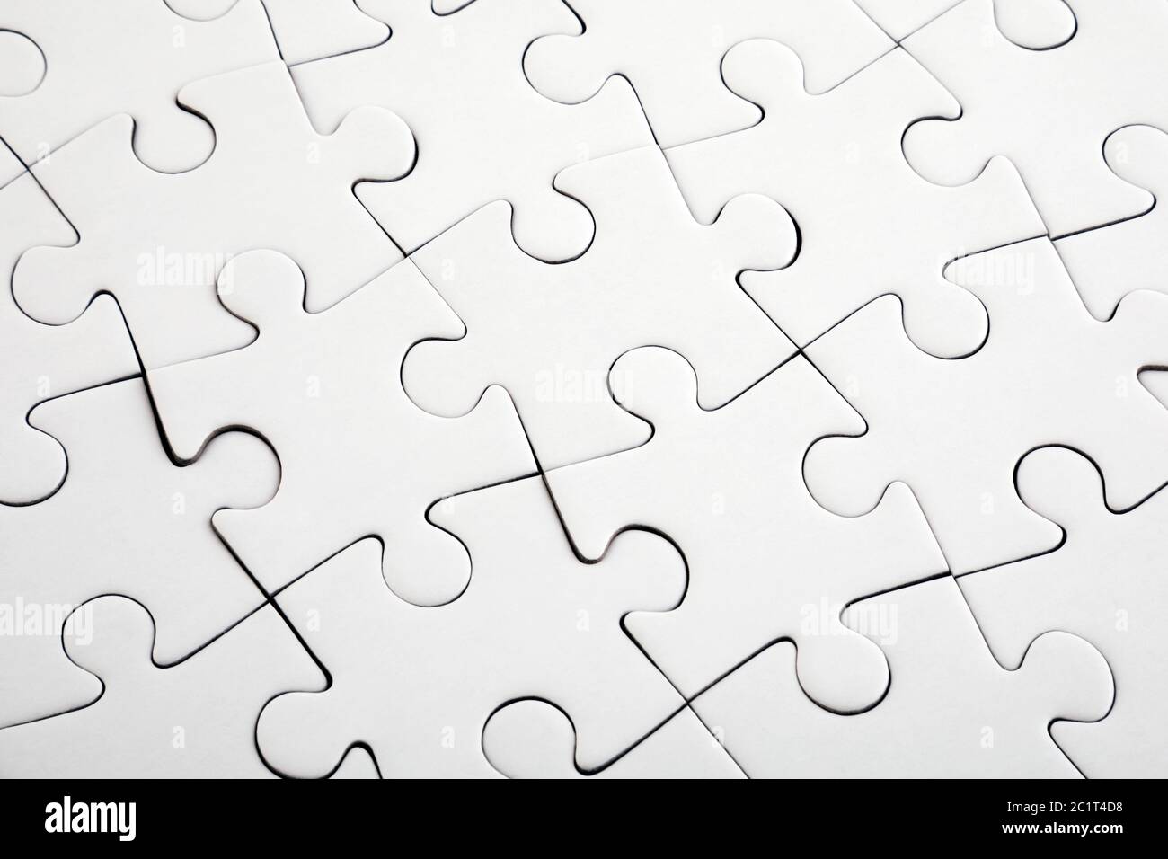 Top view of white jigsaw puzzle Stock Photo - Alamy