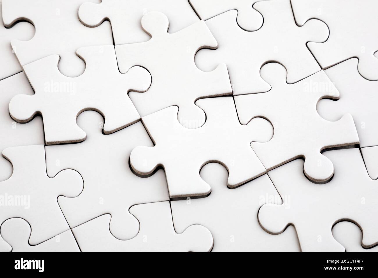 Top view of white jigsaw puzzle Stock Photo - Alamy