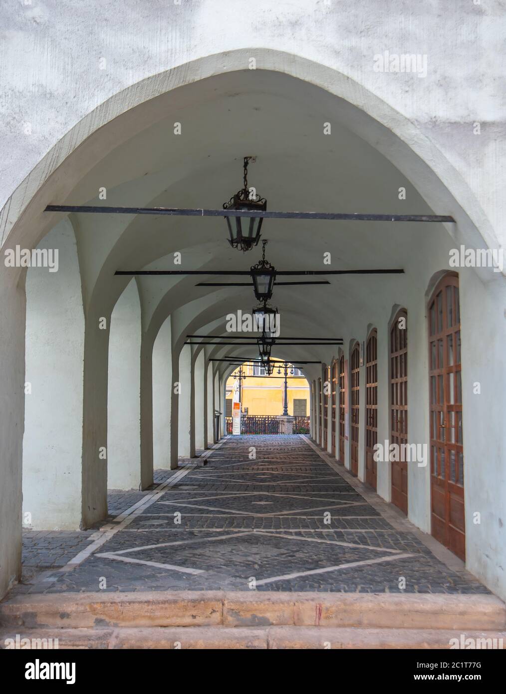 Old building terrace with arc tunnel Stock Photo - Alamy