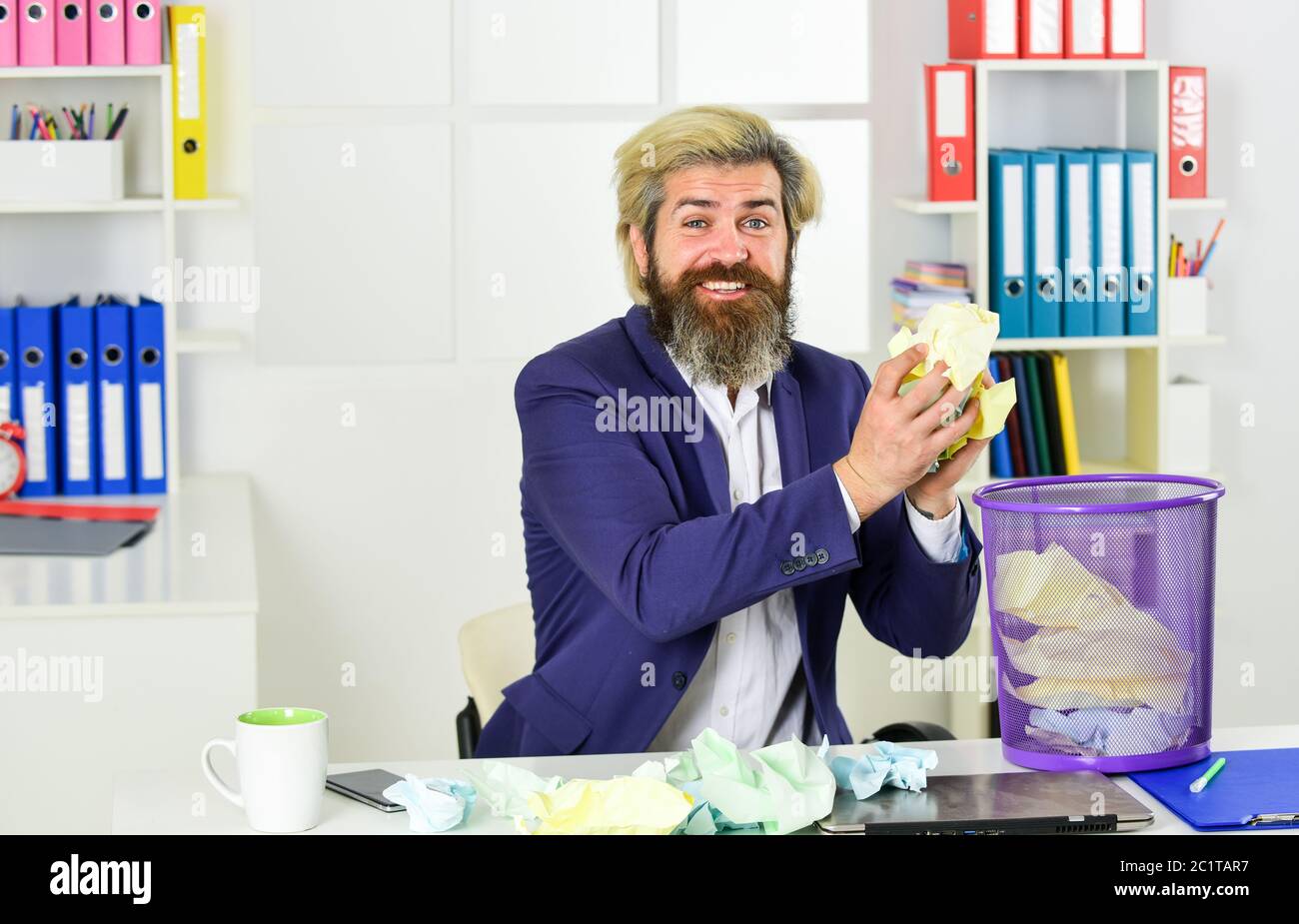 Man looking through the garbage container hi-res stock photography and ...