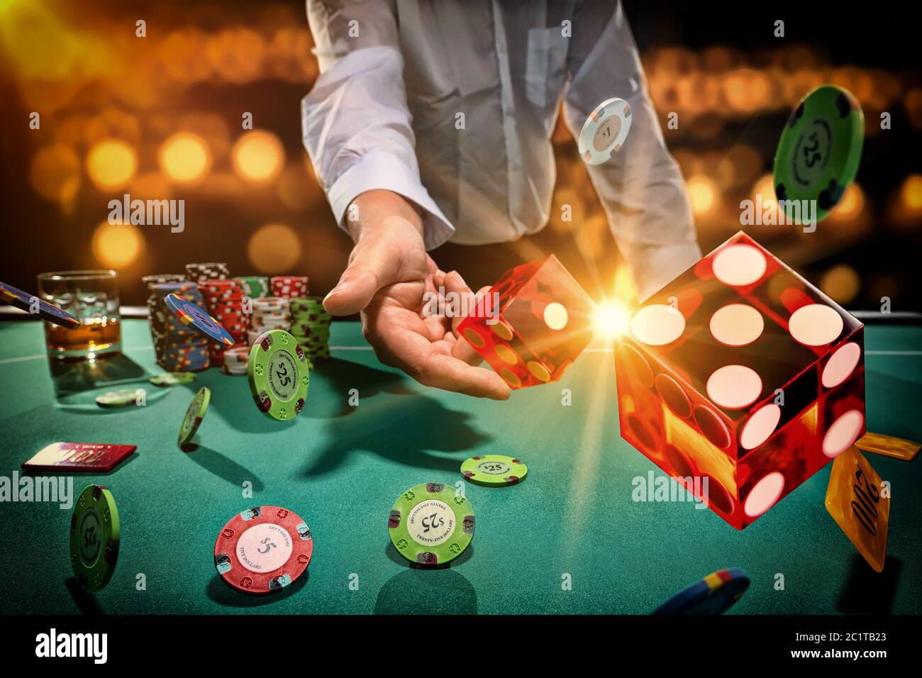 Man throwing dice at craps table hi-res stock photography and images ...