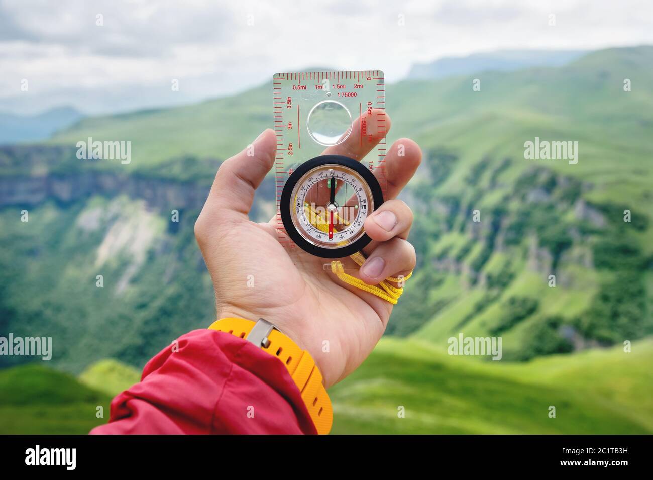 Hand holding a compass hi-res stock photography and images - Alamy