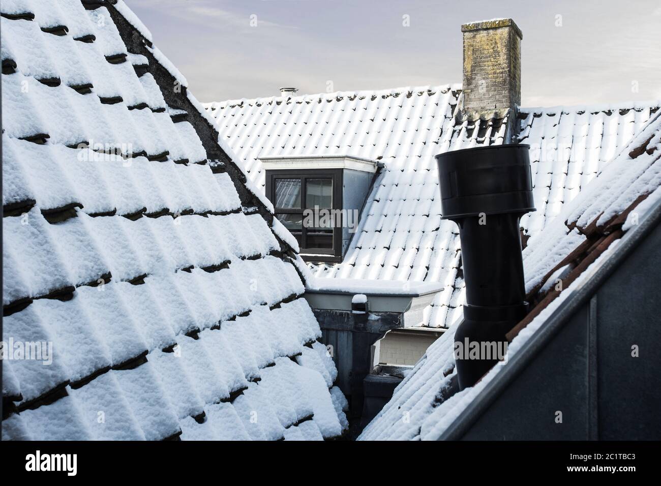 Roof apartment building covered snow hi-res stock photography and ...