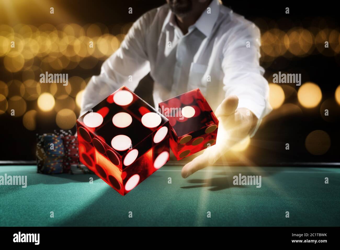 Man throwing dice at craps table hi-res stock photography and images ...
