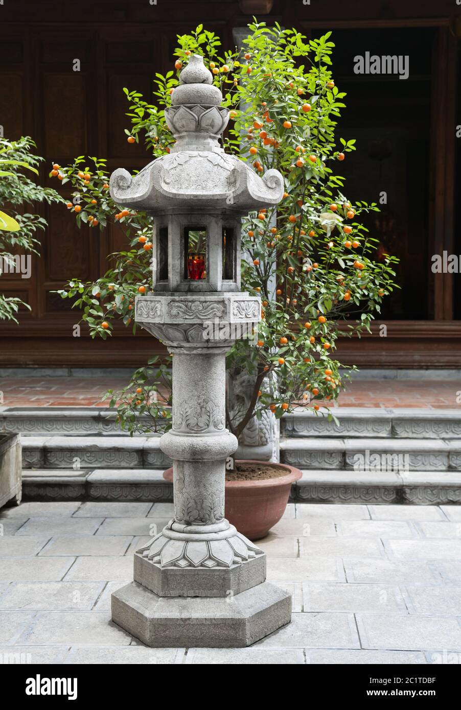 Stone buddhist lamp in japanese garden Stock Photo - Alamy