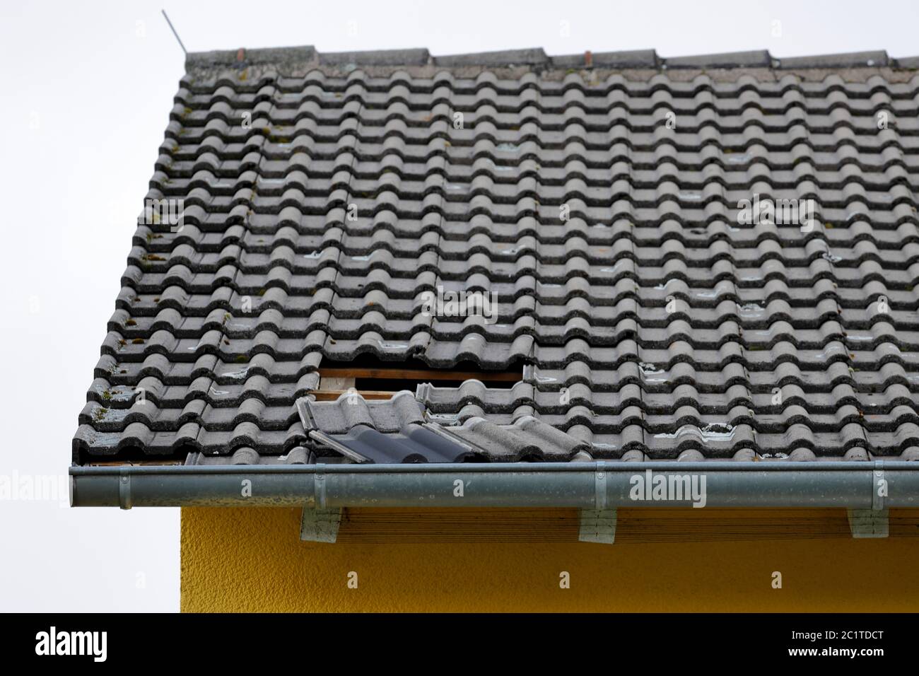 Hole in the roof by wind and storm Stock Photo - Alamy