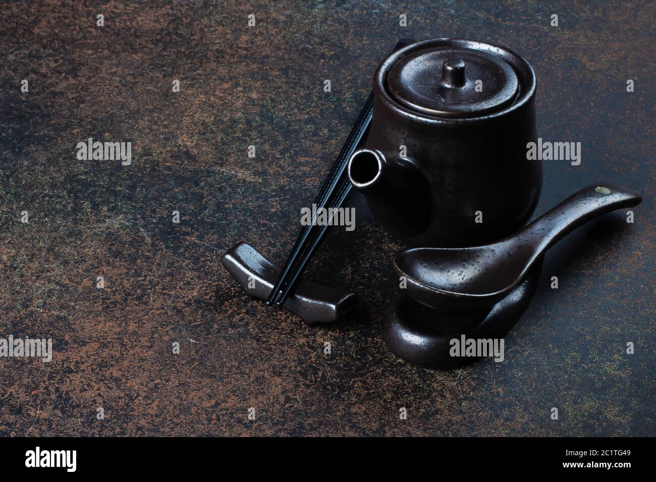 Japanese and Chinese food equipment on dark stone concrete table ...
