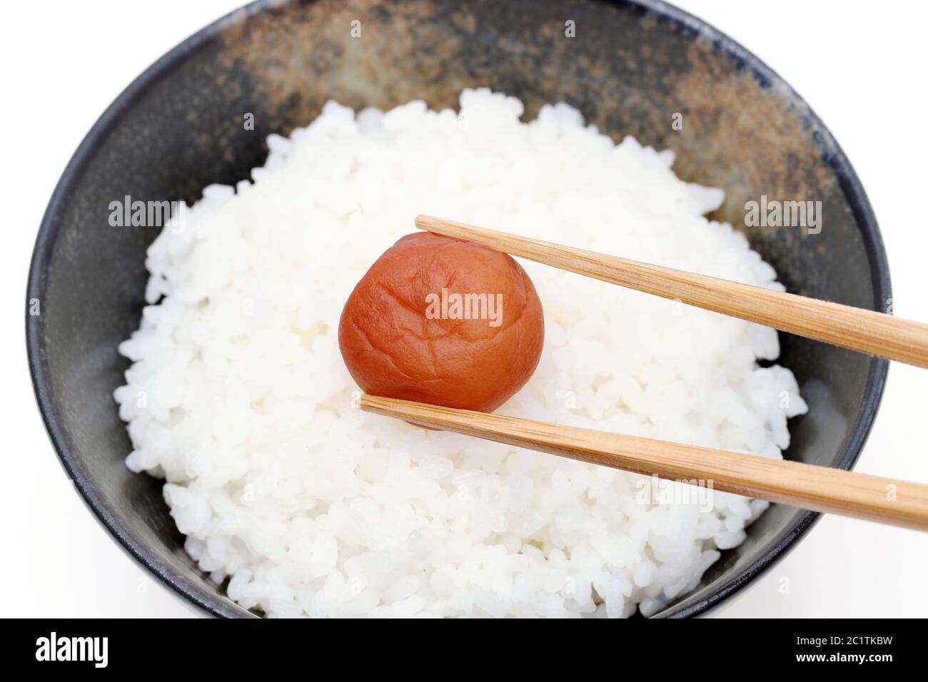 Japanese white rice and umeboshi (plum salt pickle) on a bowl Stock ...