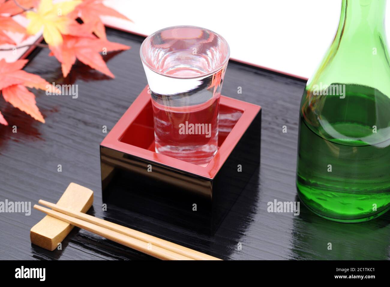 Japanese wooden box masu with sake on wooden tray, on white background ...