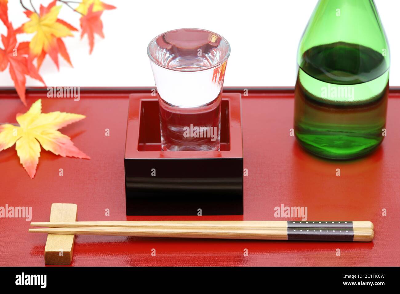 Japanese wooden box masu with sake on wooden tray, on white background ...