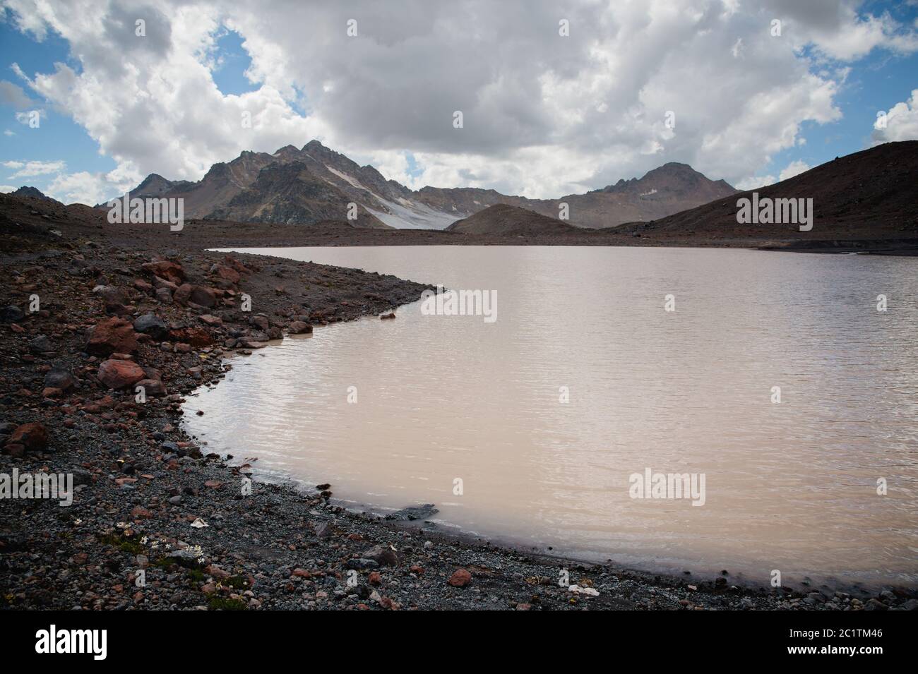 High mountain landscape of a mountain volcanic lake on the slope of the ...