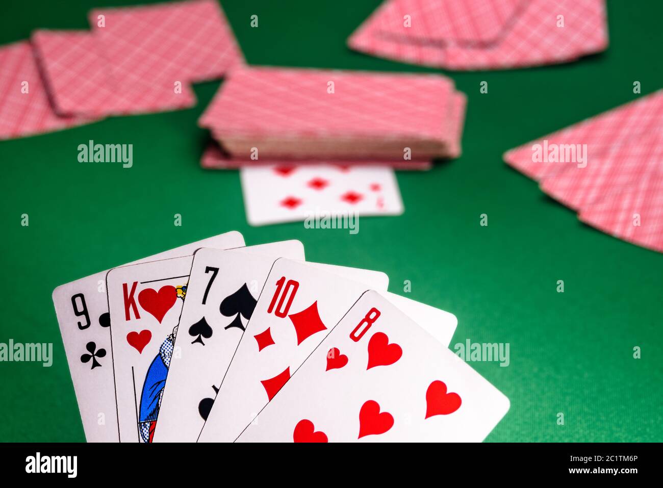 playing cards on a green table in different combinations close-up Stock ...