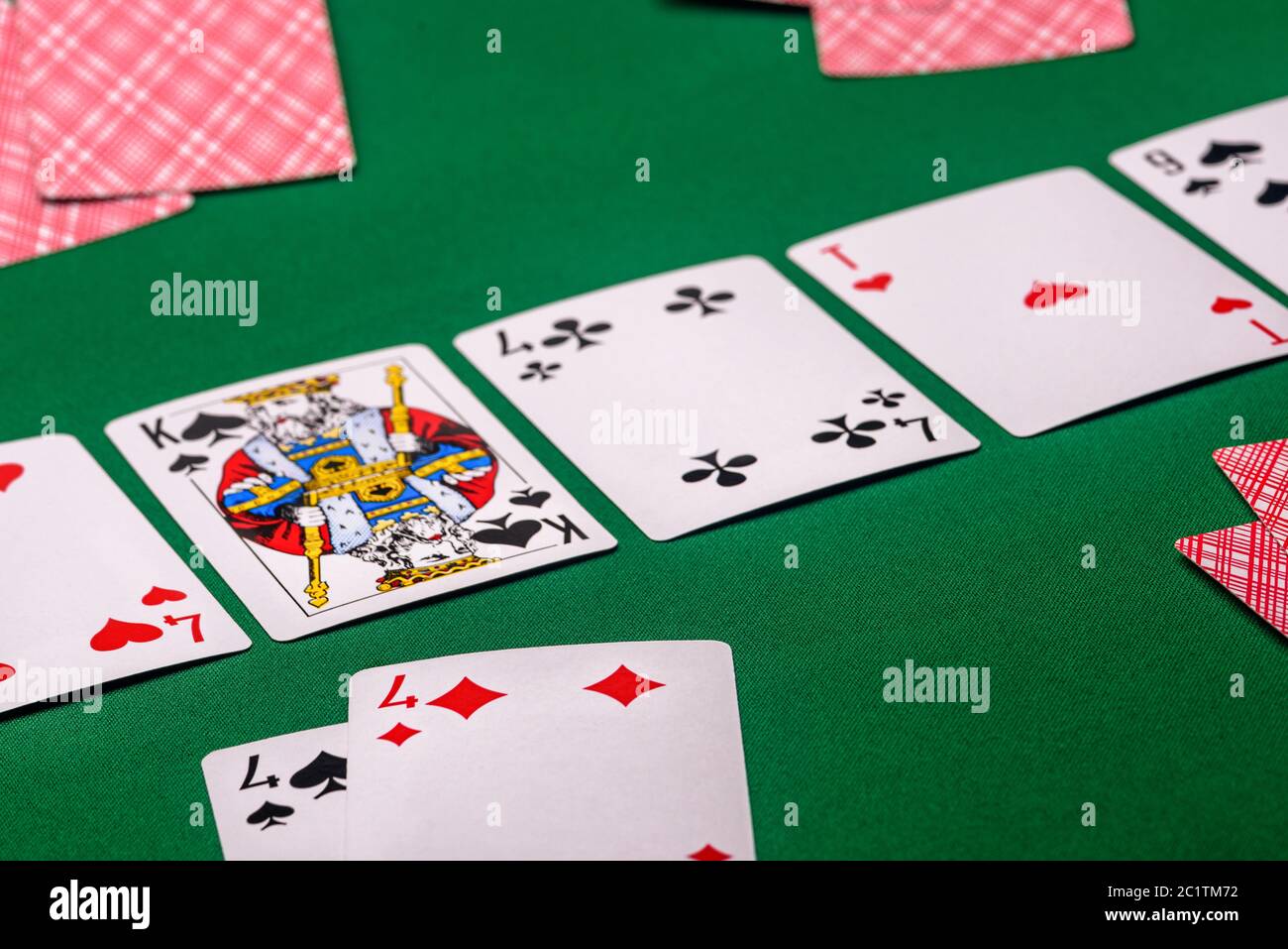 playing cards on a green table in different combinations close-up Stock ...