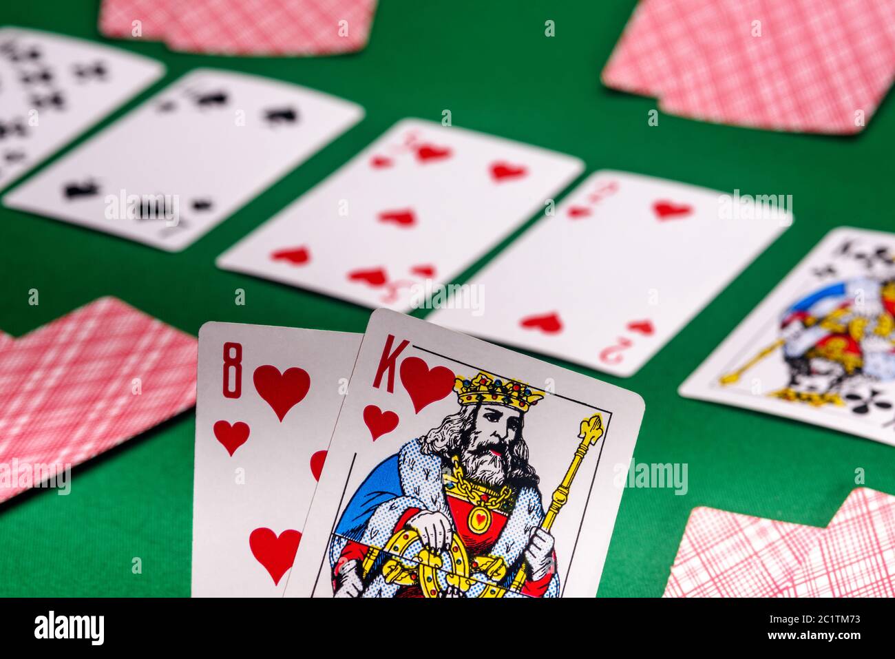 playing cards on a green table in different combinations close-up Stock ...