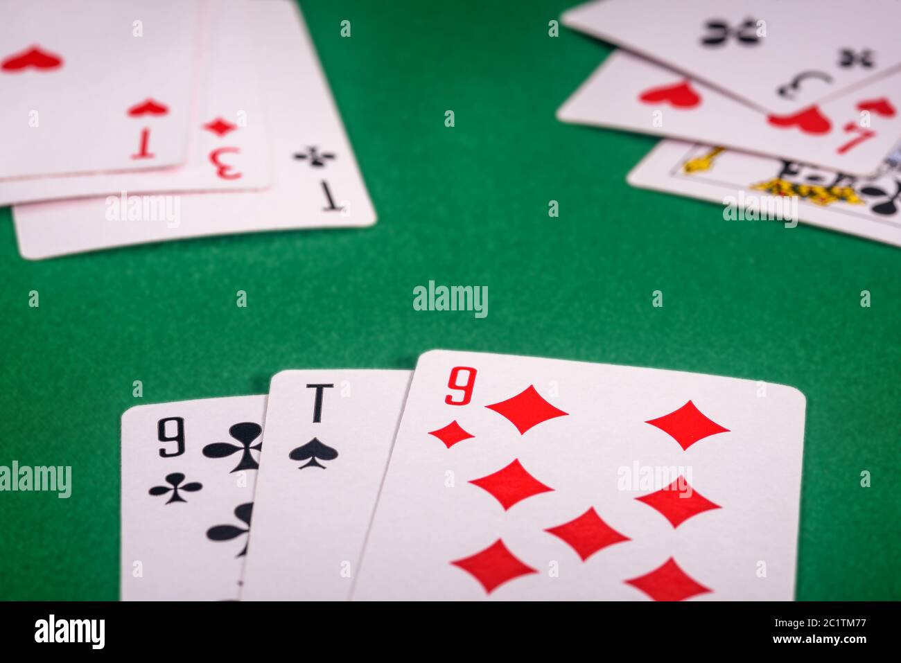 playing cards on a green table in different combinations close-up Stock ...