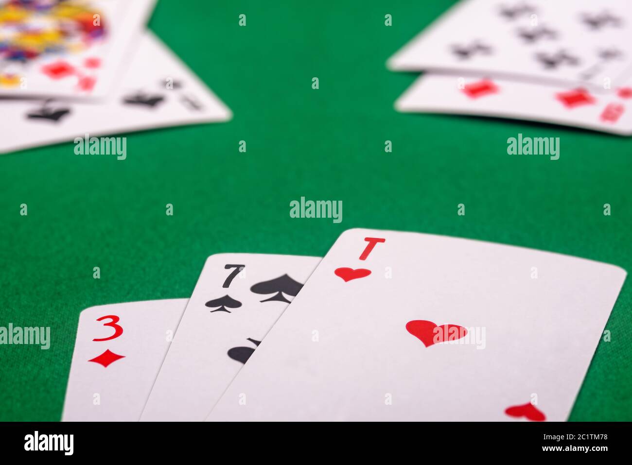 playing cards on a green table in different combinations close-up Stock ...