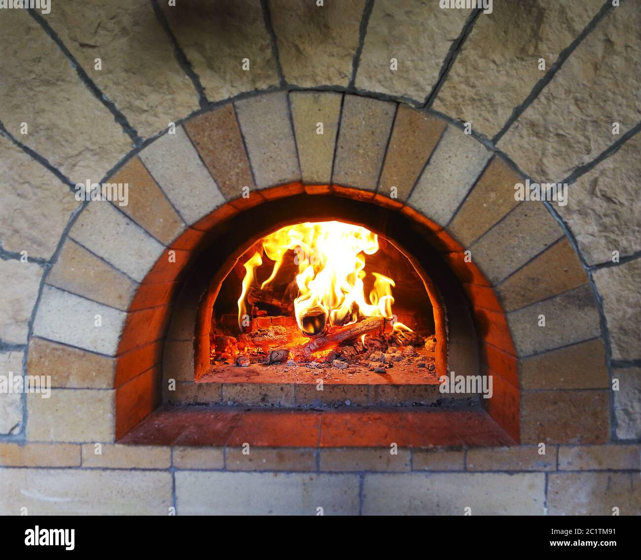 Burning firewood in traditional restaurant kitchen Stock Photo - Alamy