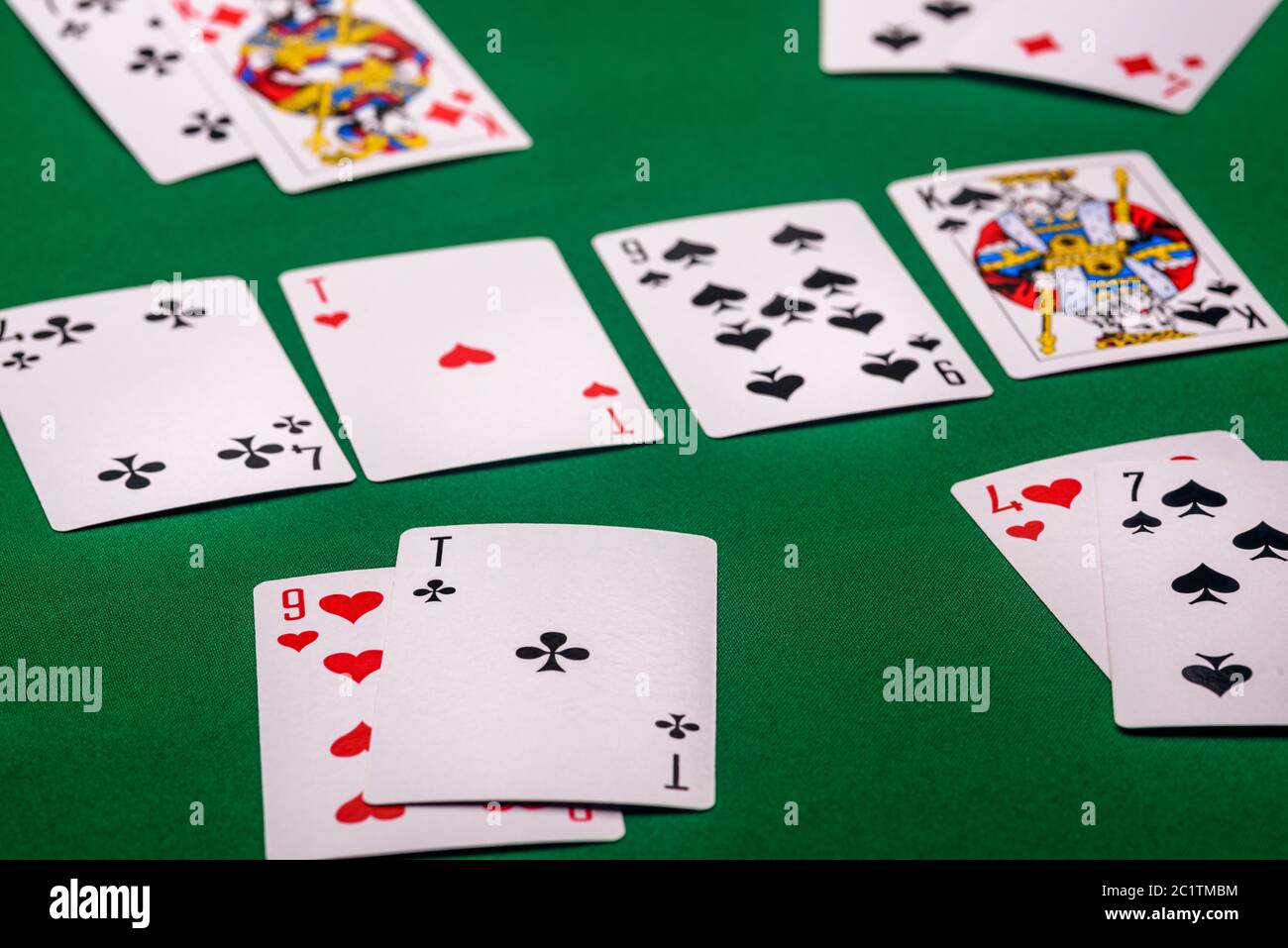 playing cards on a green table in different combinations close-up Stock ...