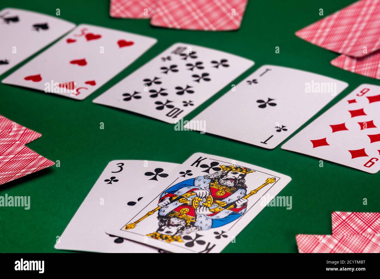 playing cards on a green table in different combinations close-up Stock ...