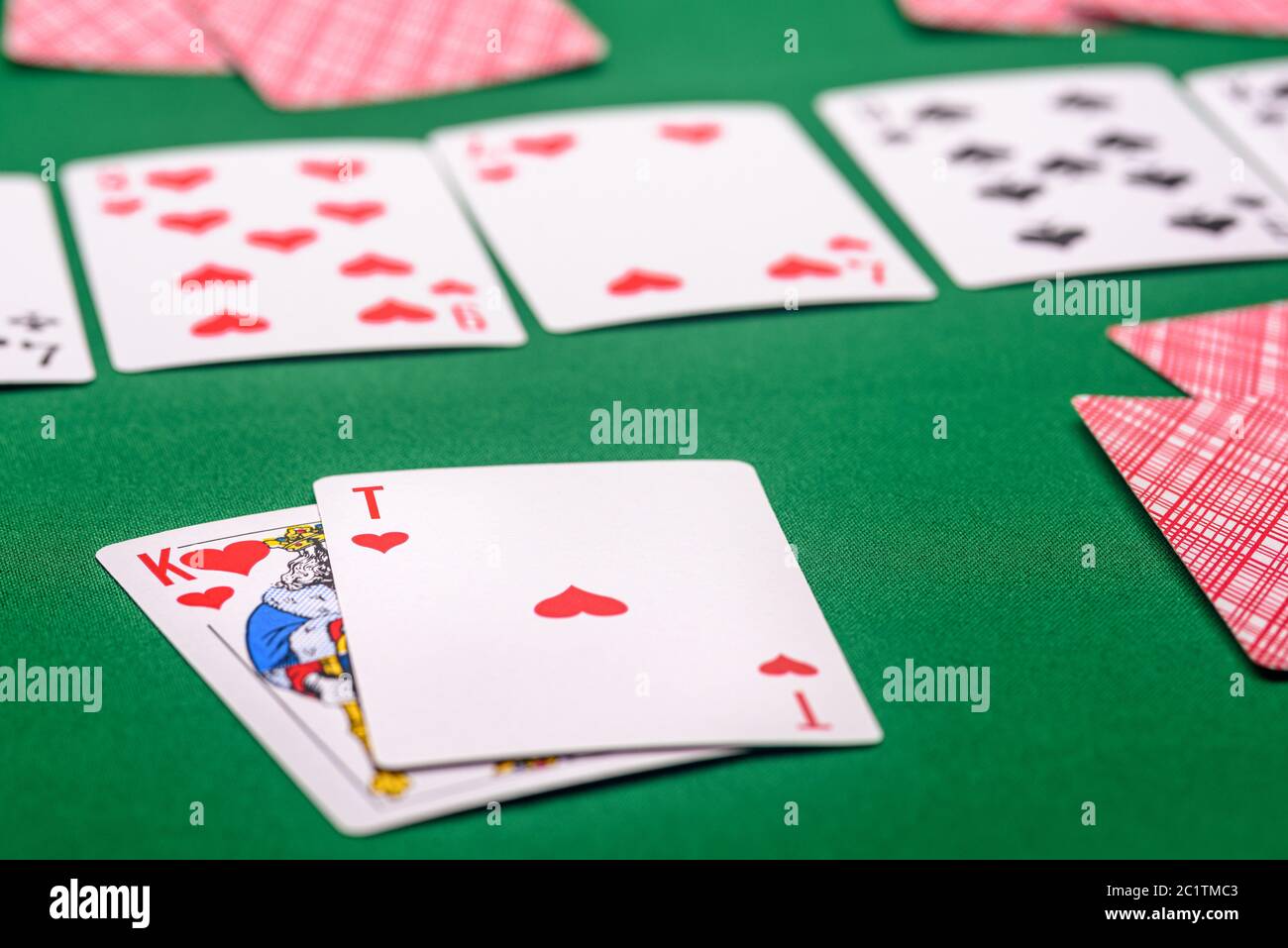 playing cards on a green table in different combinations close-up Stock ...