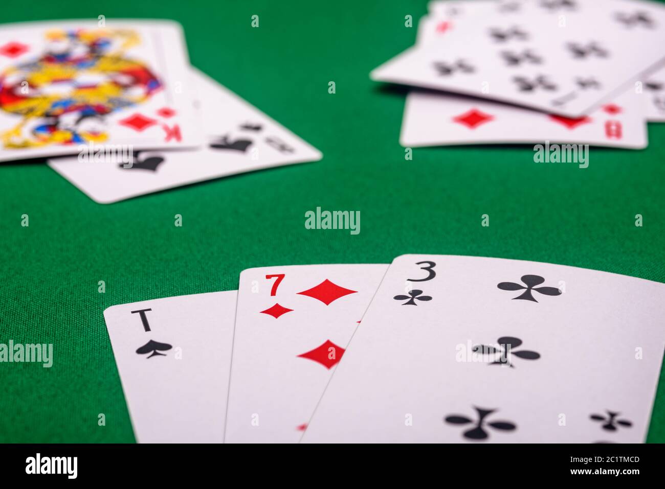 playing cards on a green table in different combinations close-up Stock ...