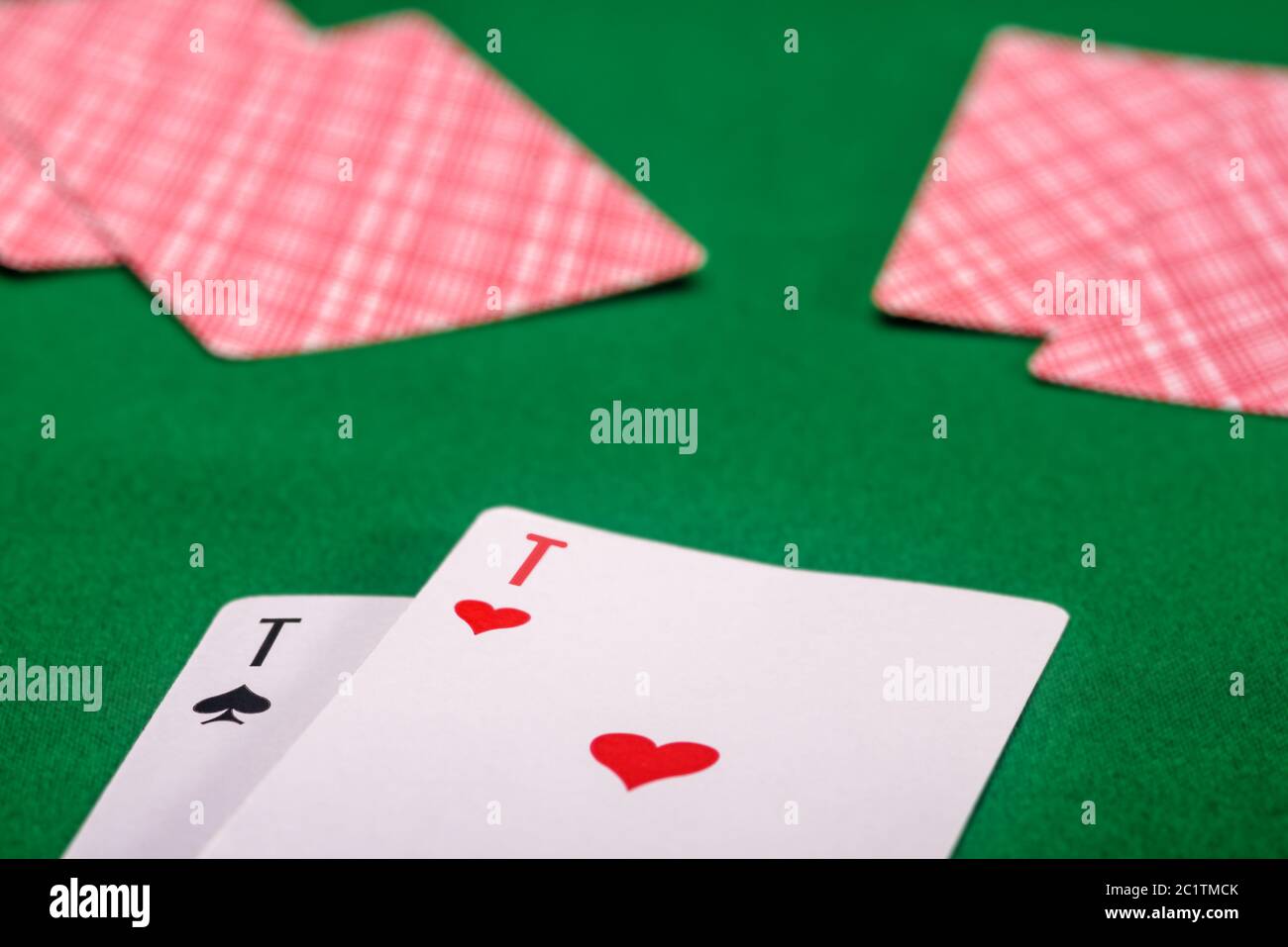 playing cards on a green table in different combinations close-up Stock ...