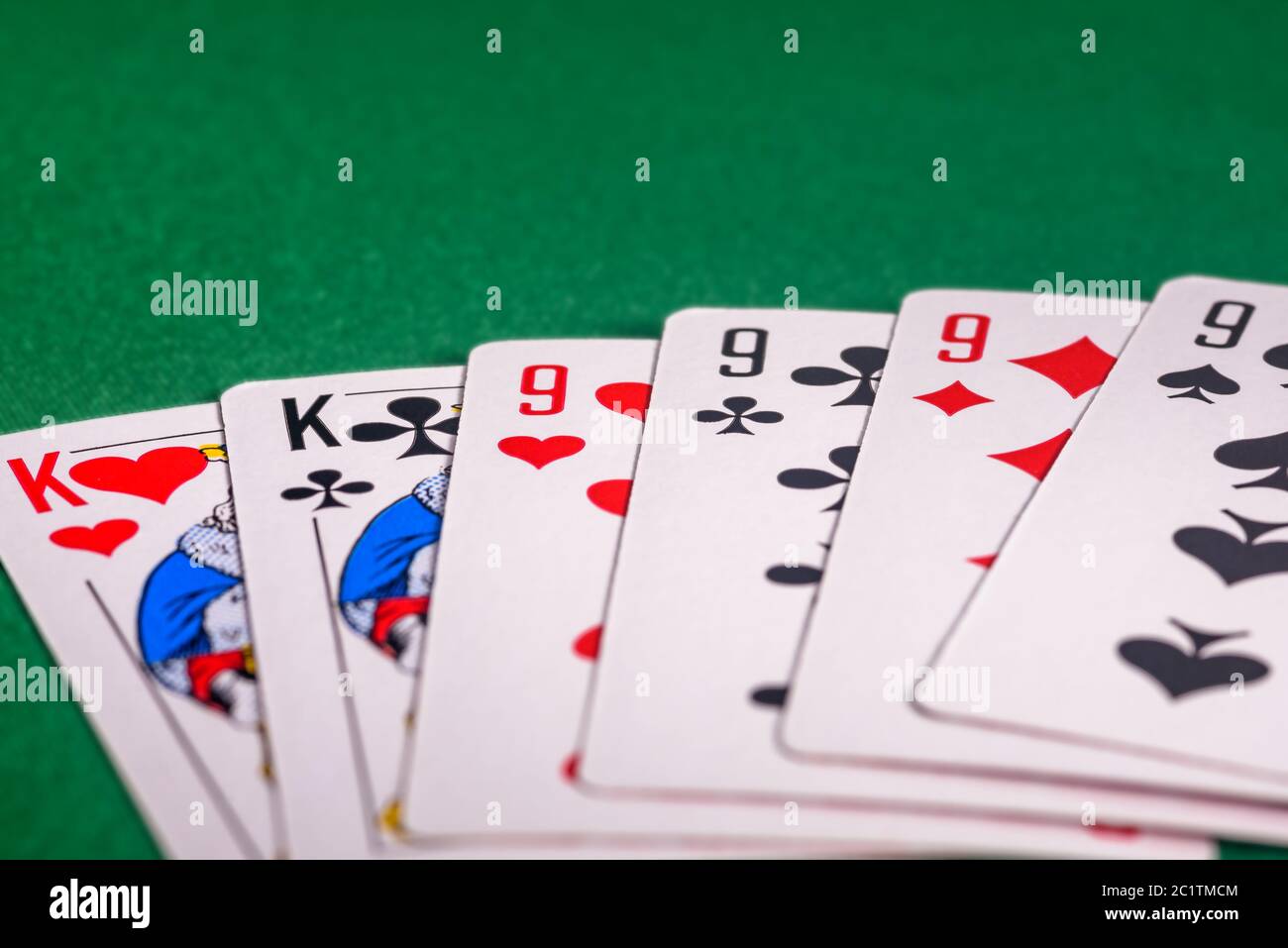 playing cards on a green table in different combinations close-up Stock ...